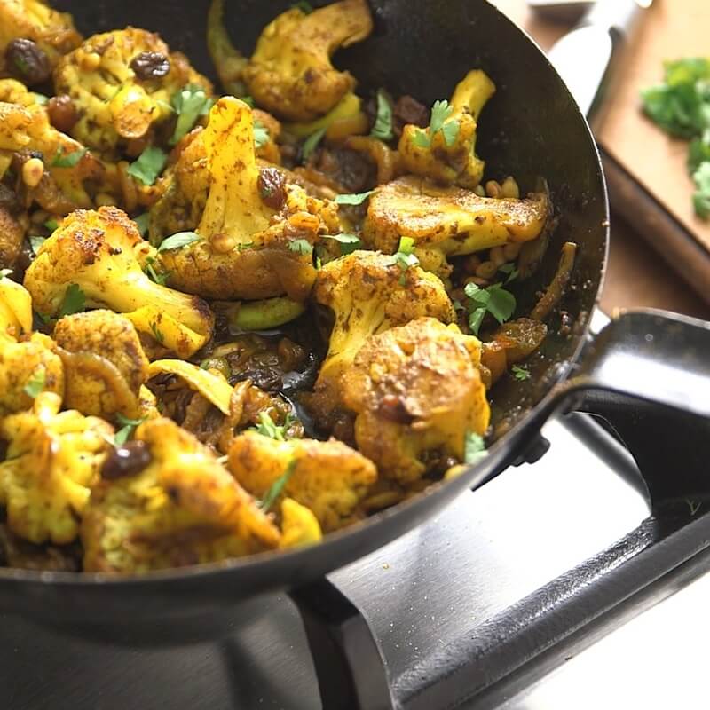 Cauliflower with saffron, pine nuts and raisins recipe / Riverford
