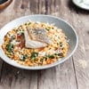 Spinach and tomato risotto with crispy pan-fried fish / Riverford