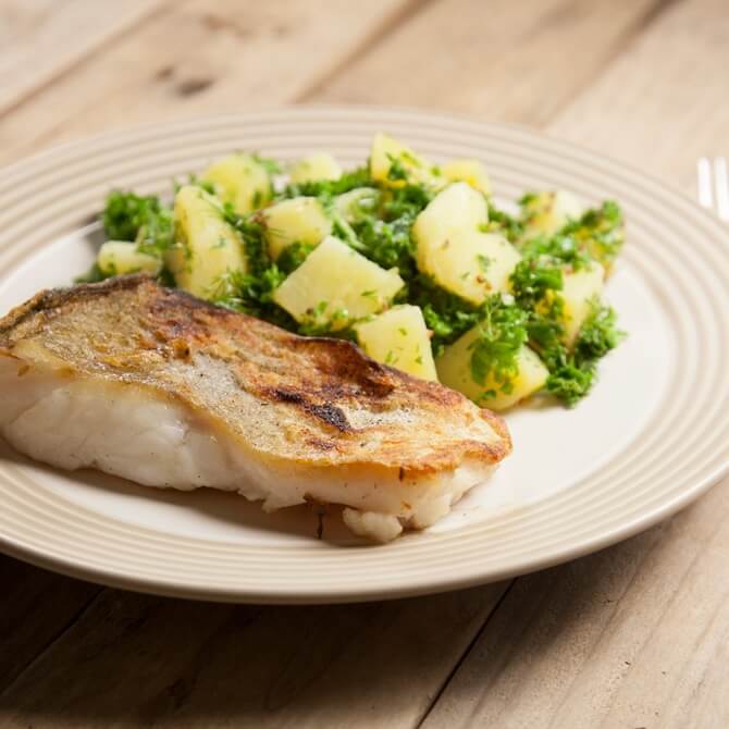 Pan-fried pollack with warm potato, kale and dill recipe / Riverford
