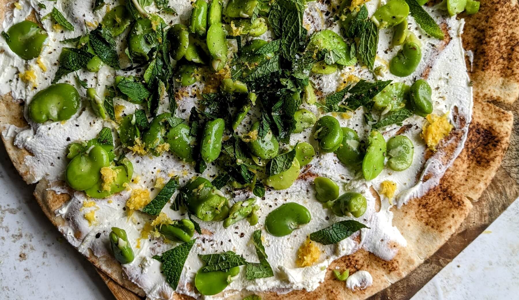 Broad bean, mint and lemon flatbread recipe / Riverford