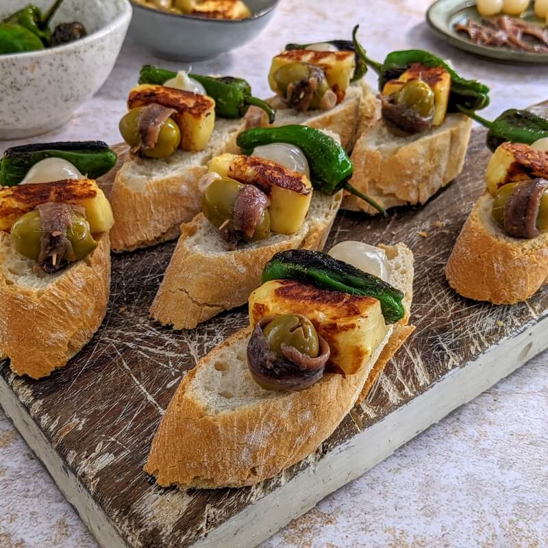 Padron pepper, halloumi and anchovy banderillas recipe / Riverford