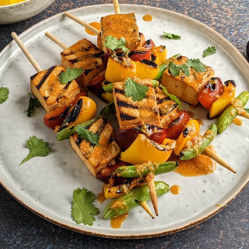 Plum and tofu skewers with miso sriracha sauce recipe / Riverford