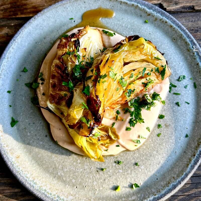 Roasted cabbage with white bean & garlic purée recipe / Riverford